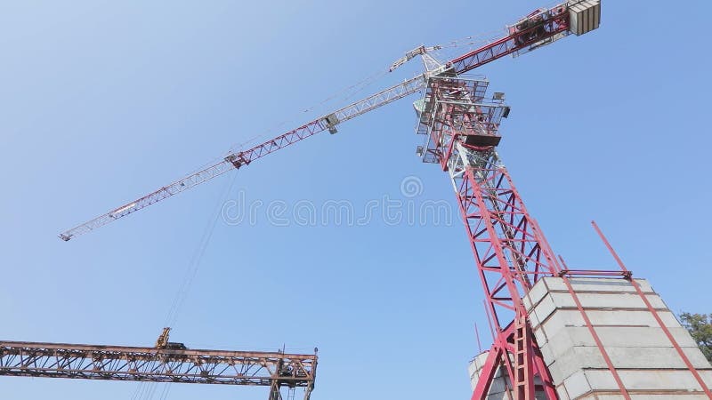 Tower Crane Working on a Construction Site. Construction Crane. Tower ... Tower Crane Working on a Construction Site. Construction Crane. Tower ...
