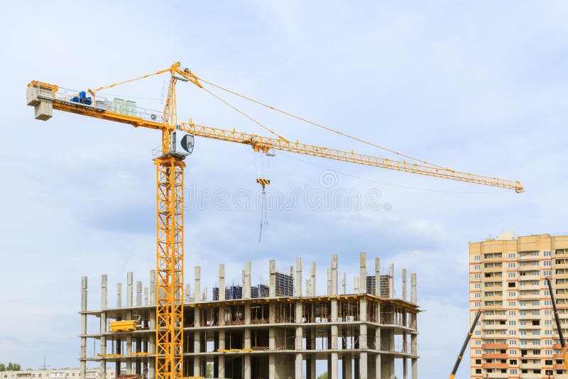 Tower Crane Working on a Construction Site Stock Photo - Image of ... Tower Crane Working on a Construction Site Stock Photo - Image of ...
