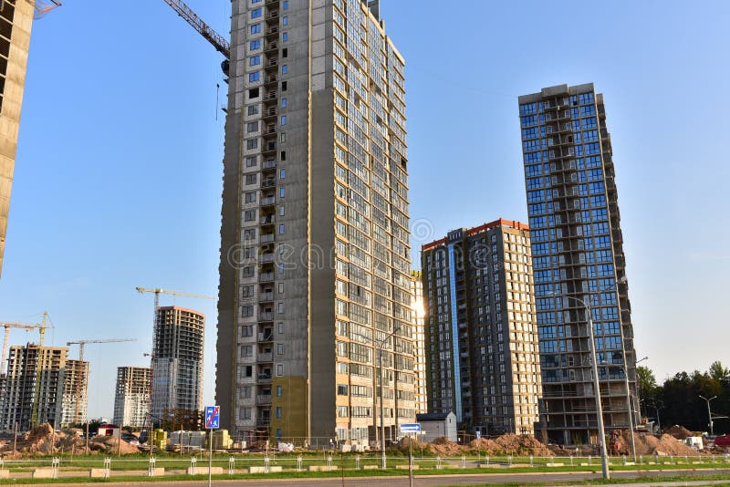 Tower Cranes in Action at Construction Site. Construction Process of ...