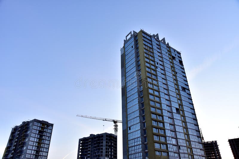 Tower Cranes in Action at Construction Site on Sunset Background ...