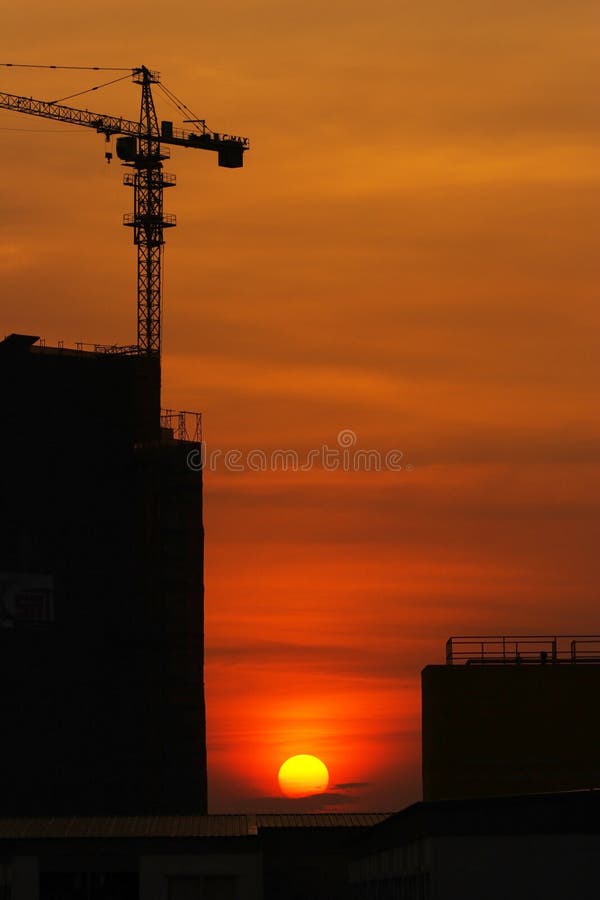 Tower Cranes at Construction Site with Sun Stock Image - Image of ...