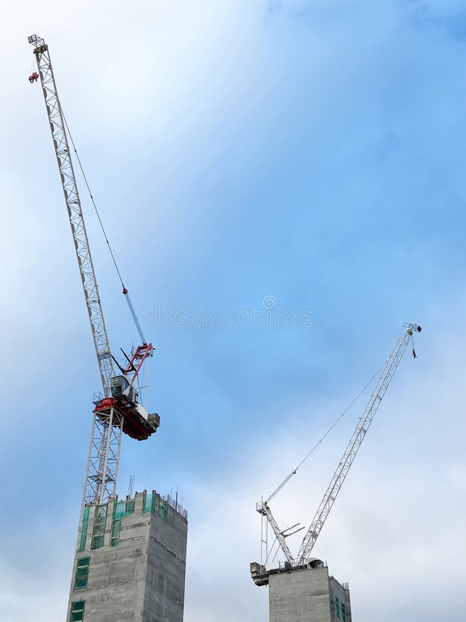 Tower Cranes at New High Rise Apartment Development during Construction ...