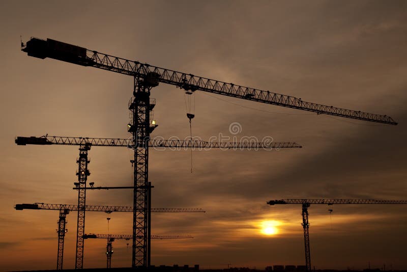 Cranes at sunset stock photo. Image of business, industry - 8096462