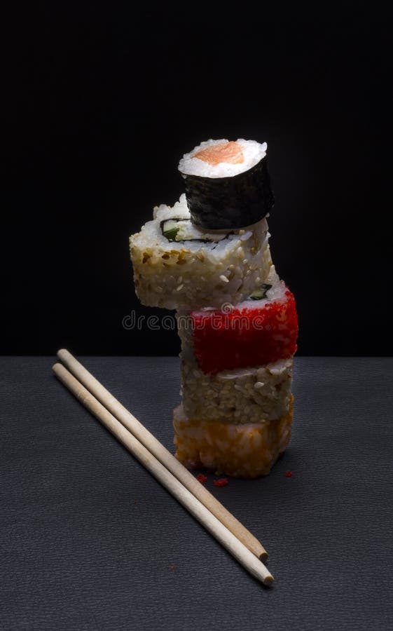 Tower of Different Japanese Rice Rolls with Traditional Sticks Stock ...