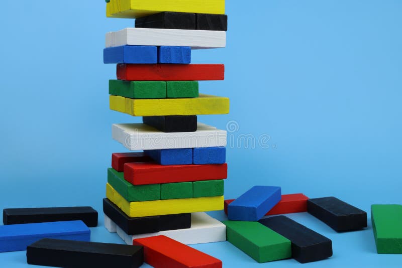 Tower Game and Scattered Colored Wooden Blocks Stock Image - Image of ...