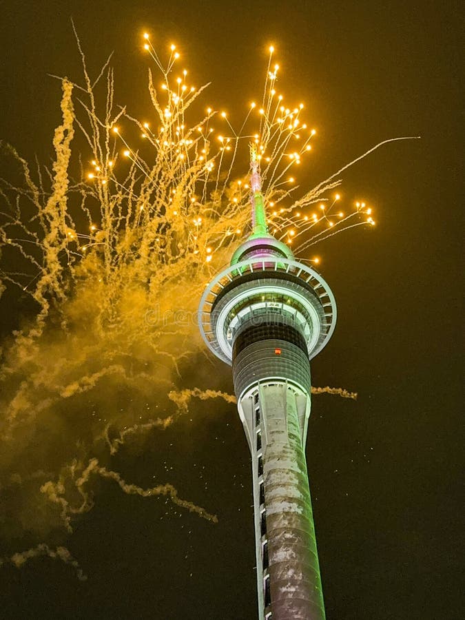 Tower Illuminated by Fireworks at Night Editorial Photo - Image of ...