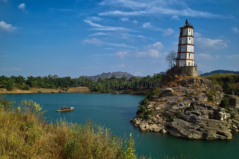 Tower on island in ocean stock image. Image of asian - 12582227