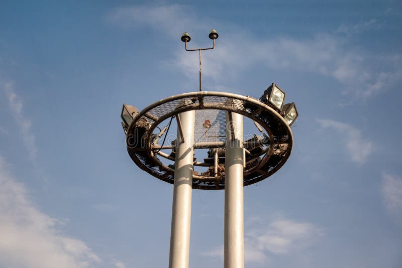 Tower of Lighting and Equipment at the Airport Against the Blue Sky ...