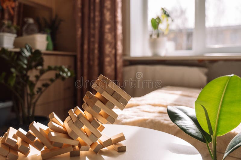 A Tower Made of Wooden Blocks is Collapsing Stock Image - Image of ...