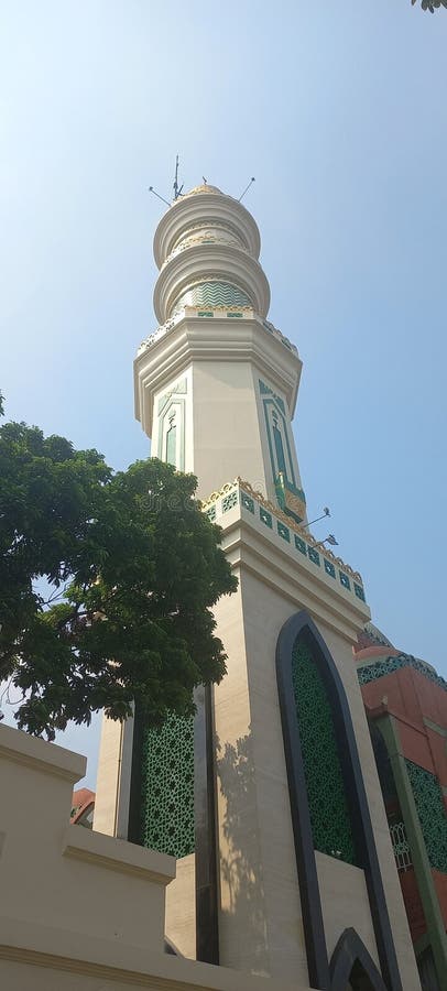 The Tower of Mosque Rises High into the Sky Stock Photo - Image of ...