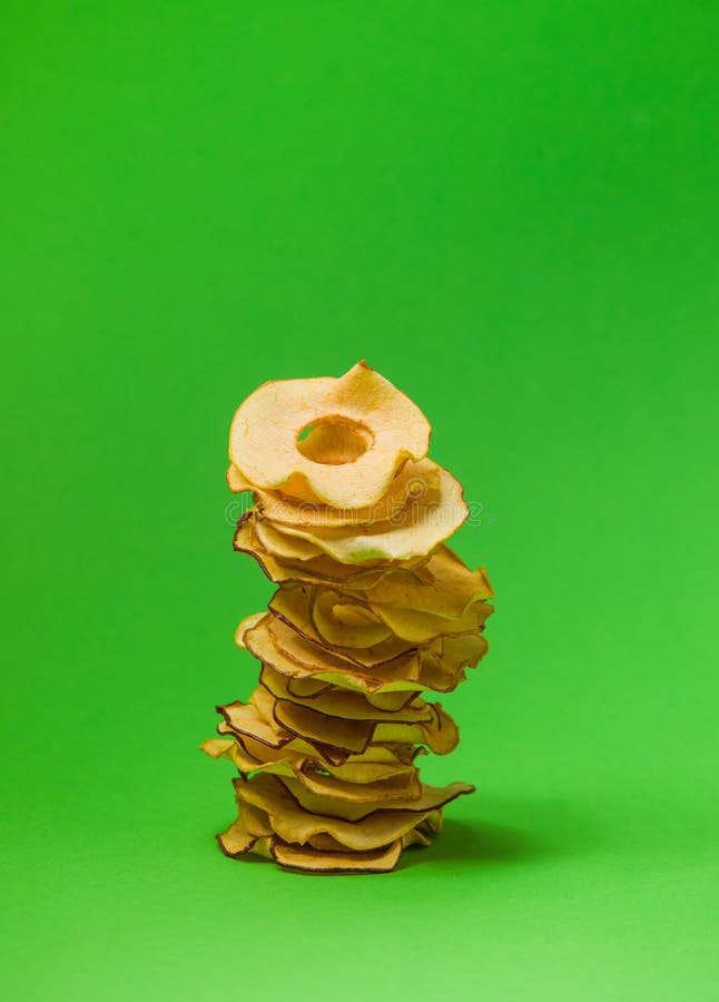 Tower of Round Dried Slices of Apple on the Green Stock Photo - Image ...
