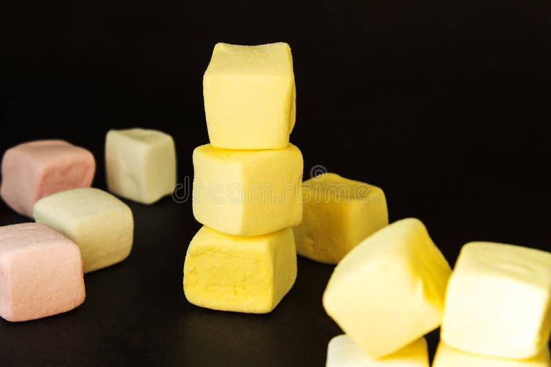 Tower of Saturated Yellow Marshmallows, Square, in the Dark, Close-up ...