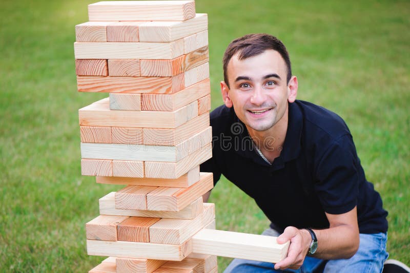 Group Game of Physical Skill with Big Blocks Stock Image - Image of ...