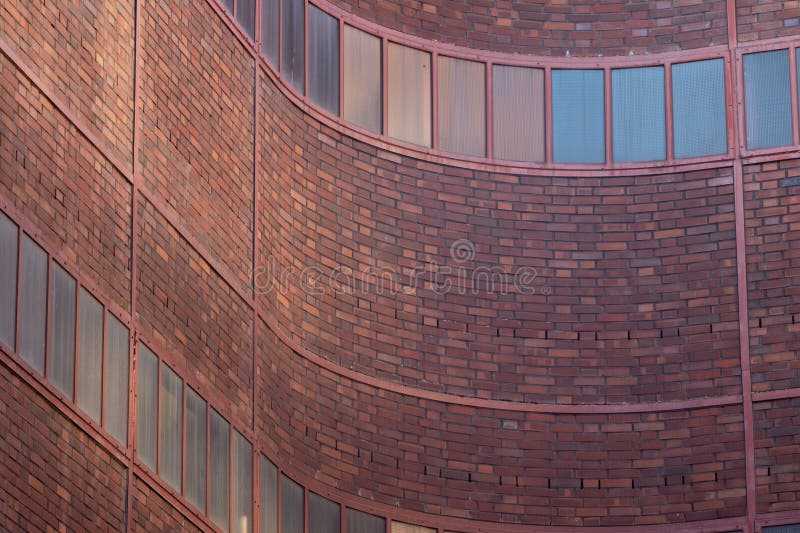 Towering Brick Building with Multiple Windows in View Against a ...