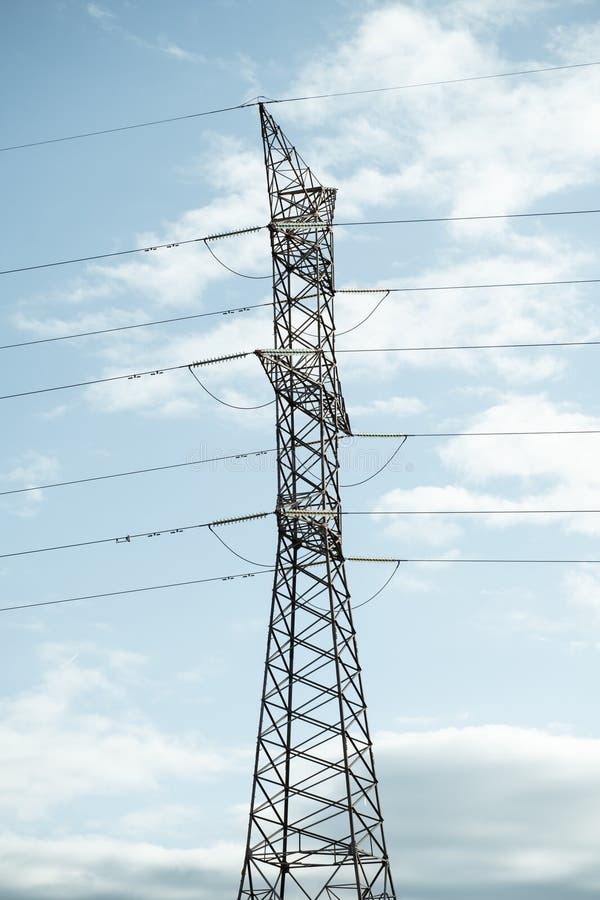 Towering Electrical Power Line Against Cloudy Sky Stock Image - Image ...