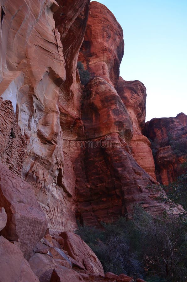 Towering Red Rock Cliffs the Foundation for Cliff Dwellings Stock Image ...