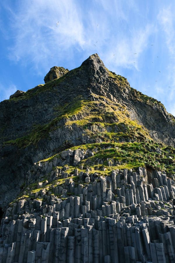 Towering Rock Against Blue Sky. View from Below Stock Image - Image of ...