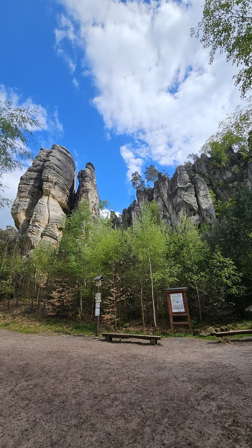 Towering Rock Formations Rise Dramatically Against a Bright Blue Sky ...