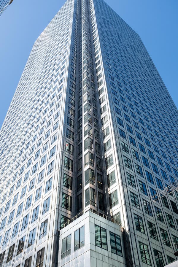 A Towering Skyscraper with a Modern, Glass Facade Featuring a Grid of ...