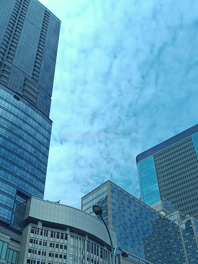 Towering Skyscraper Pierces the Clouds: a Modern Architectural Wonder ...