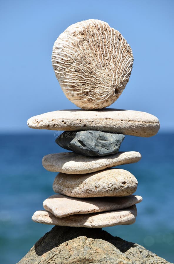 Towering Stack of Meditation Stones by the Ocean Stock Photo - Image of ...