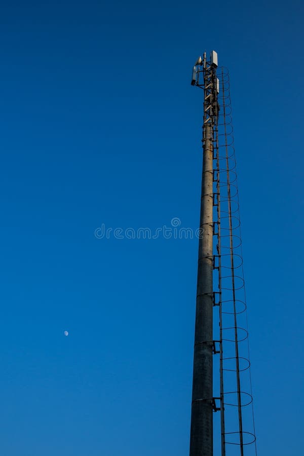 A Towering Transmitter Station Against a Backdrop of an Electric Blue ...