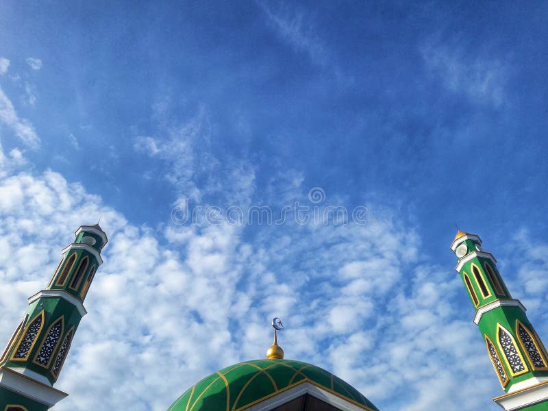The Towers of the Mosque Under the Blue Sky Stock Image - Image of ...