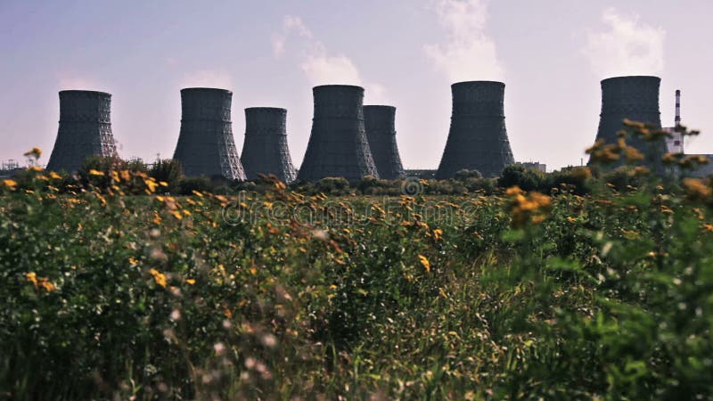 Nuclear Power Plant Cooling Towers Emitting Steam into Clear Blue Sky ...