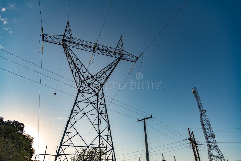 The Towers and the Power Pole and the Setting Sun Stock Photo - Image ...