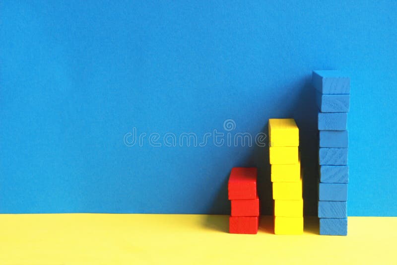 Towers of Red, Yellow and Blue Toy Blocks in Front of Blue Wall Stock ...