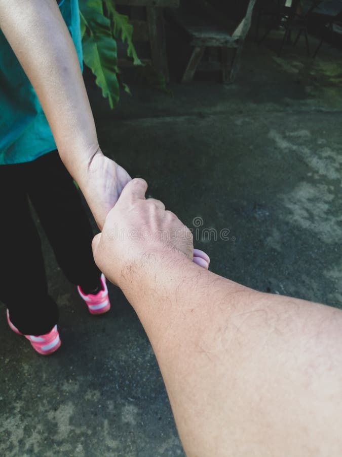 Towing, Holding Hands of Two People Stock Photo - Image of interaction ...