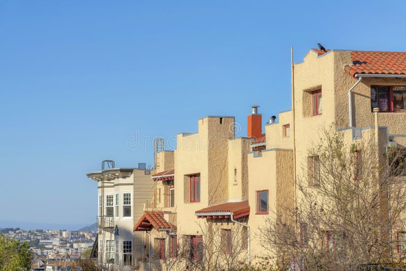 Townhouses in San Francisco, CA with Leafless Trees at the Front and ...
