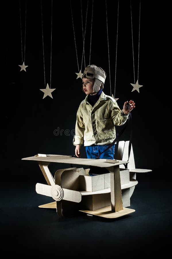 Boy and biplane. stock image. Image of aviator, airplane - 76743825