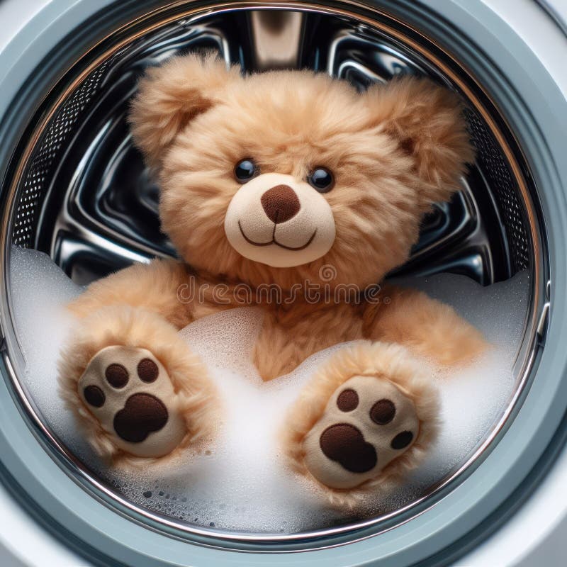 A Toy Bear in Soap Foam Sits in a Washing Machine. Stock Image - Image ...