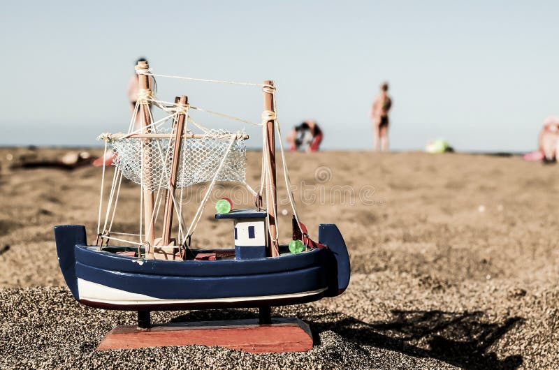 Toy Boat on the Sand Beach stock photo. Image of summertime - 304790458