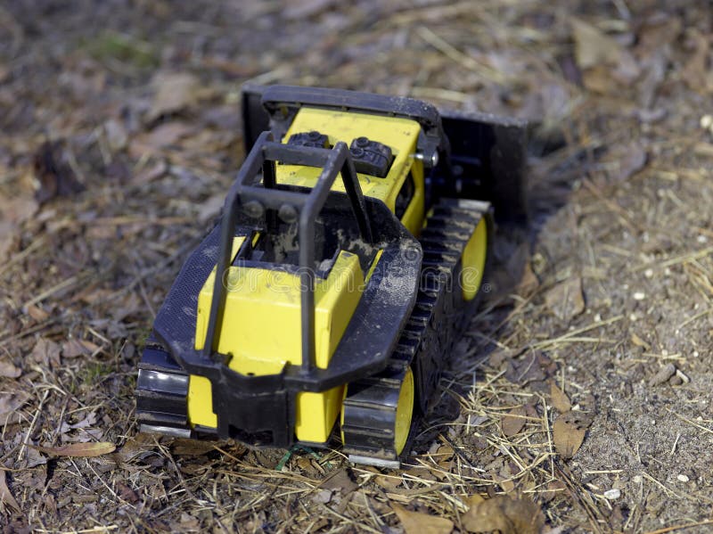 A Toy Bulldozer in the Dirt Stock Image - Image of soil, device: 266778073