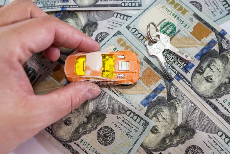 Toy Car in Hand, Keys and Money on the Table Stock Photo - Image of ...