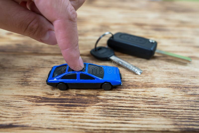 Toy Car in Hand, Car Keys on the Table Stock Photo - Image of gasoline ...