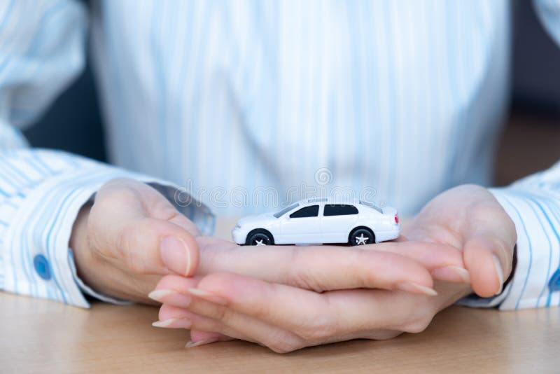 Toy Car in the Hands of Women. Protecting the Security Concept Stock ...