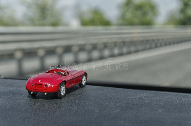 Toy car inside a real car editorial image. Image of machine - 95147420