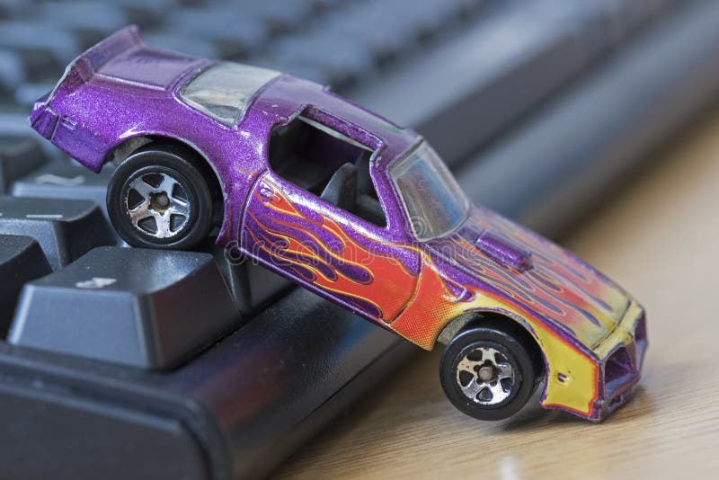 Toy car on a keyboard stock image. Image of work, purple - 99064973