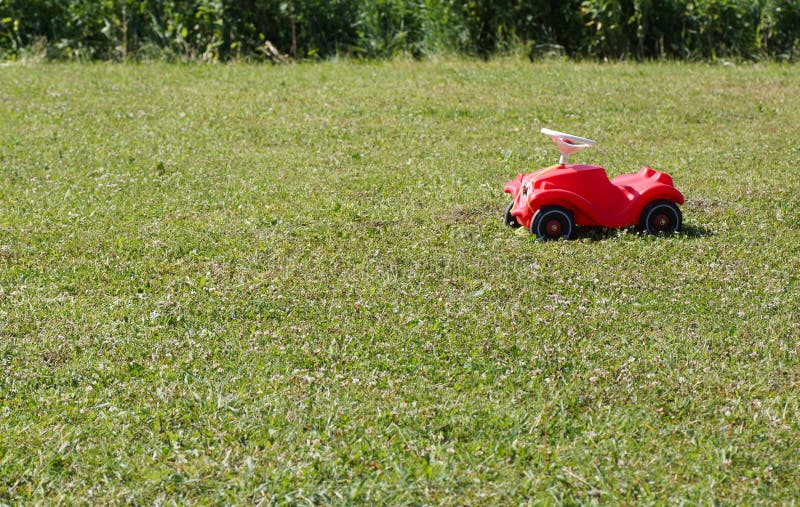 Toy car on the lawn. stock photo. Image of plastic, babies - 44555256