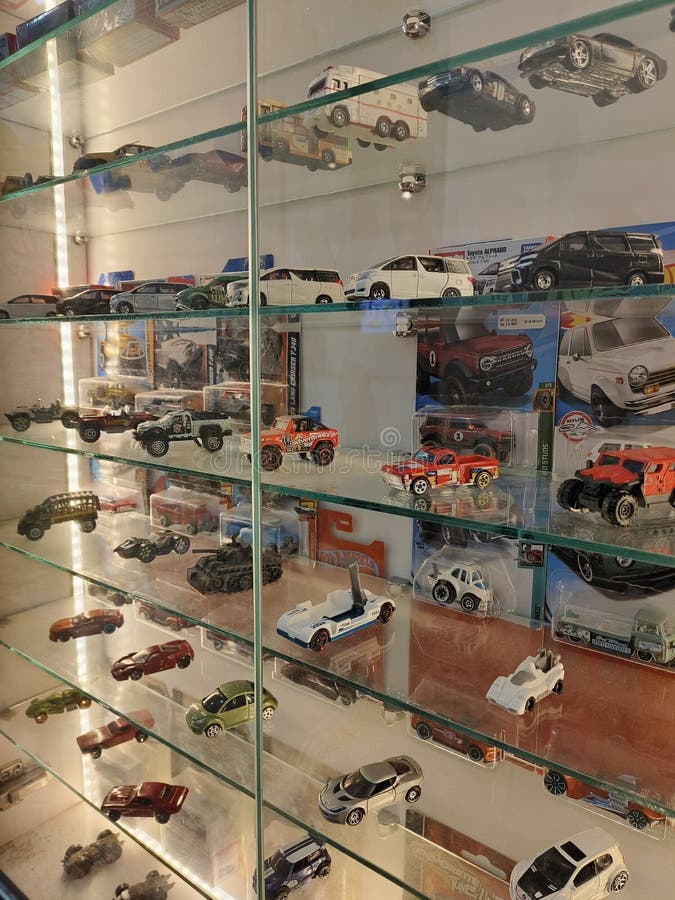Toy Cars on Glass Shelf? editorial photography. Image of shelf - 277100812