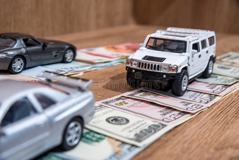 Two Toy Cars with Cash in Hand. Stock Photo - Image of female, symbol ...