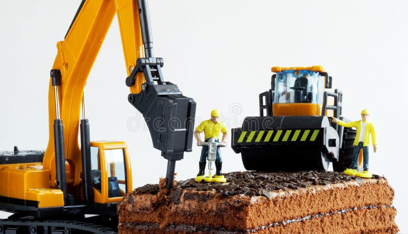 Toy Construction Machinery and Worker with Jackhammer Work on Chocolate ...
