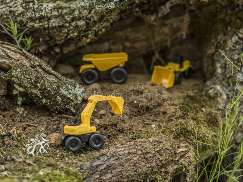 Toy Construction Machinery Working on an Excavation Stock Image - Image ...