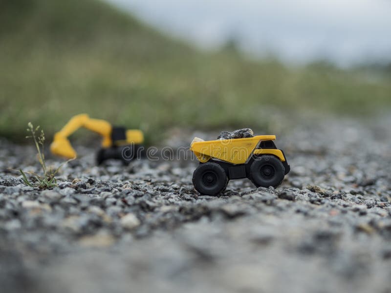 Toy Construction Machinery Working on an Excavation Stock Image - Image ...