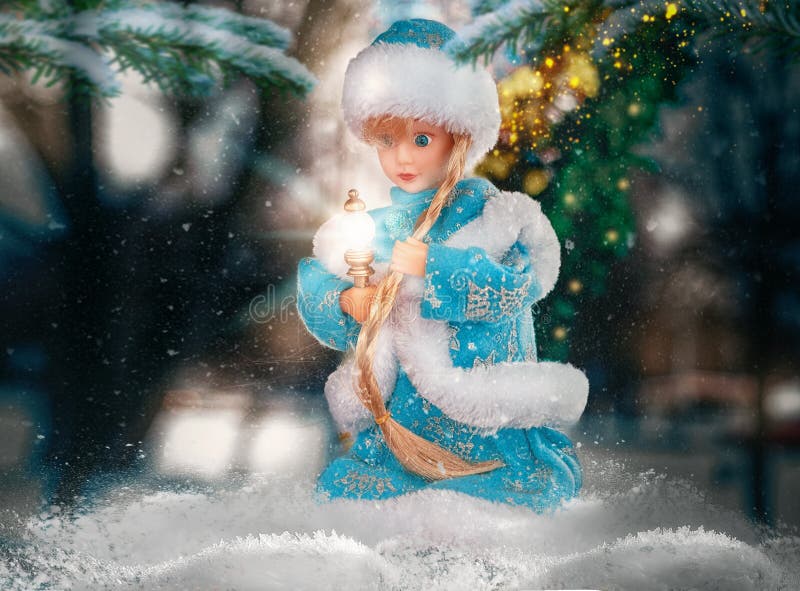 Toy doll in the snow stock image. Image of doll, souvenir - 264276443
