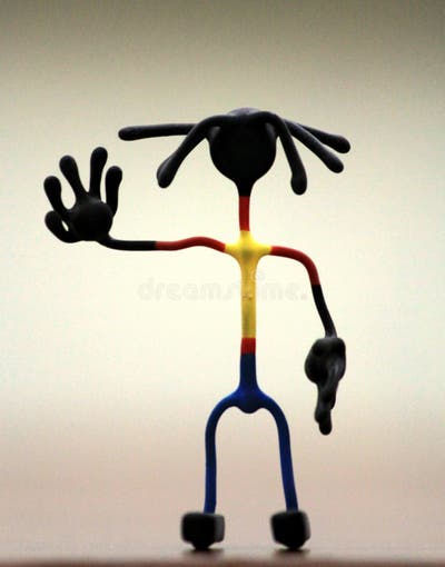 Toy Figure Waving Hand Dreadlocks Stock Photo - Image of hair, symbolic ...