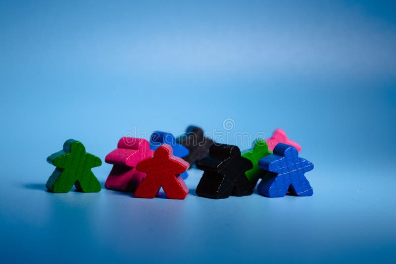Toy Figures in Various Positions on a Blue Surface Stock Image - Image ...